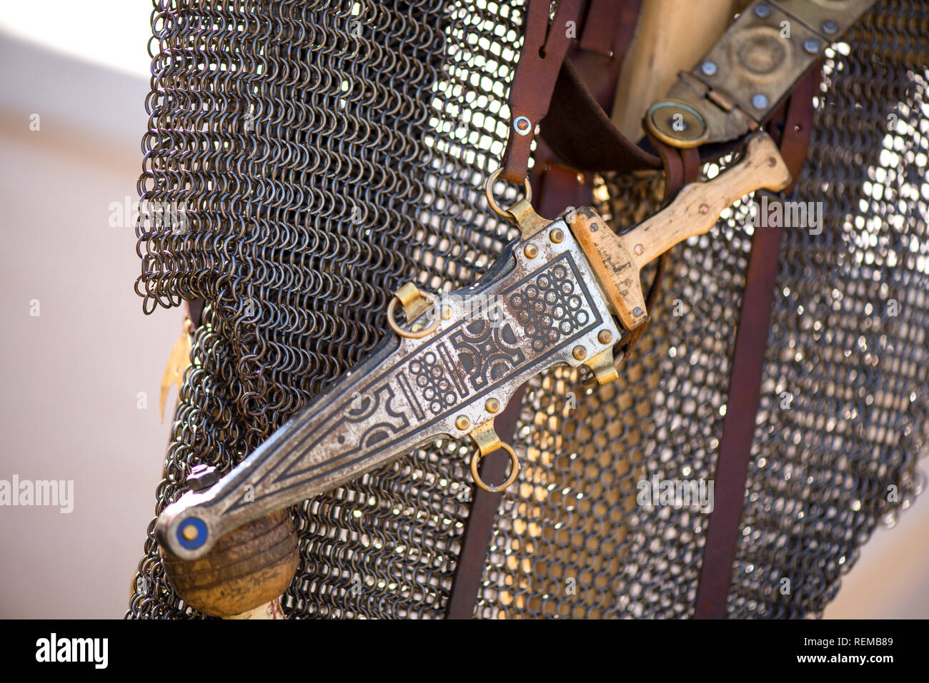 Silver or bronze medieval dagger with ornaments attached to chain ...