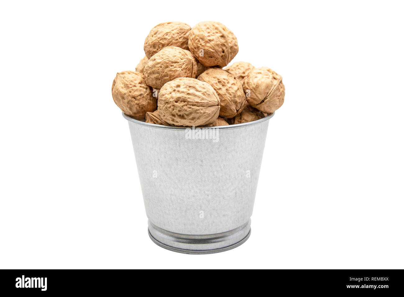 Walnuts in a tin bucket on white background. With clipping path Stock ...