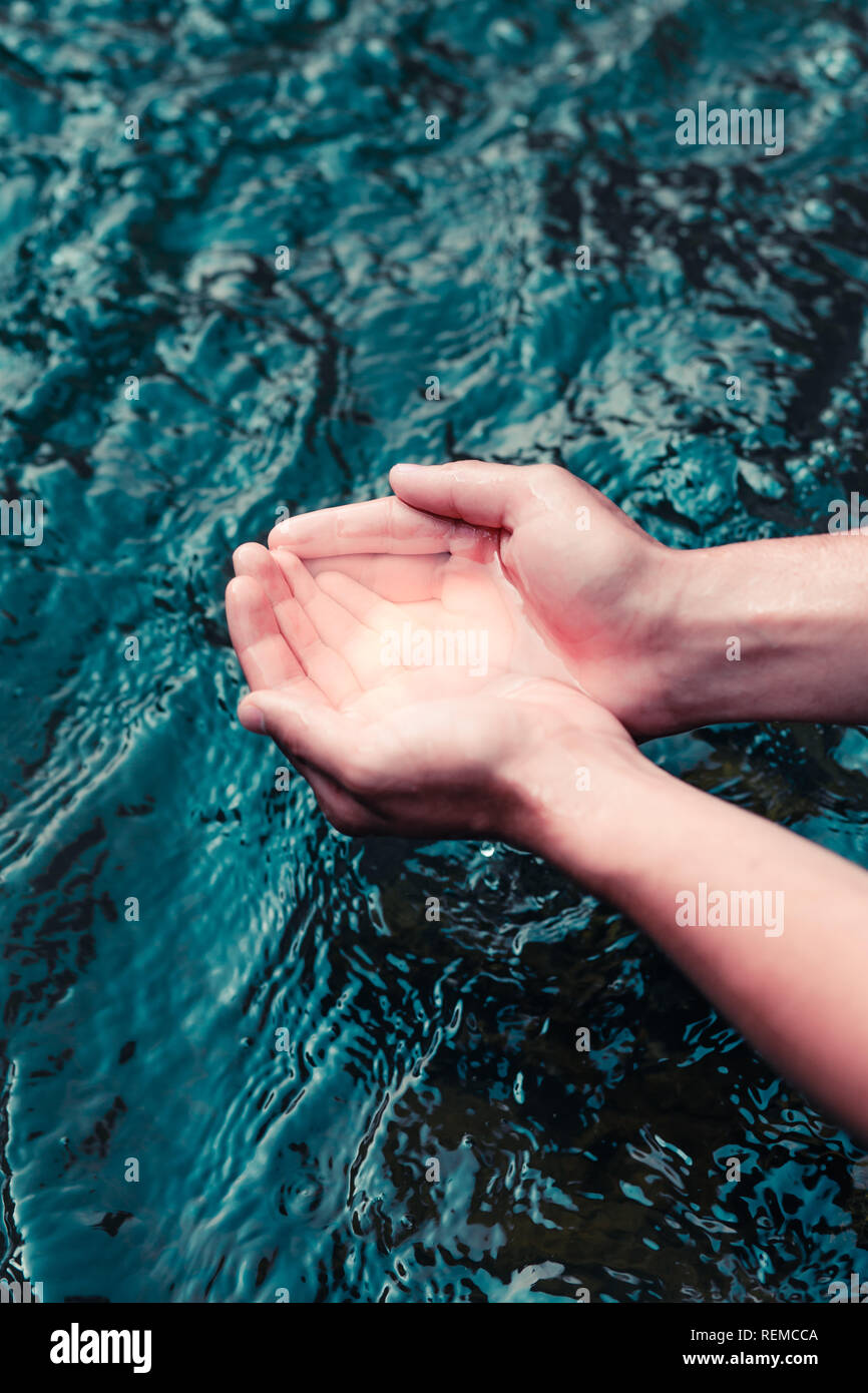 Hands holding water hi-res stock photography and images - Alamy