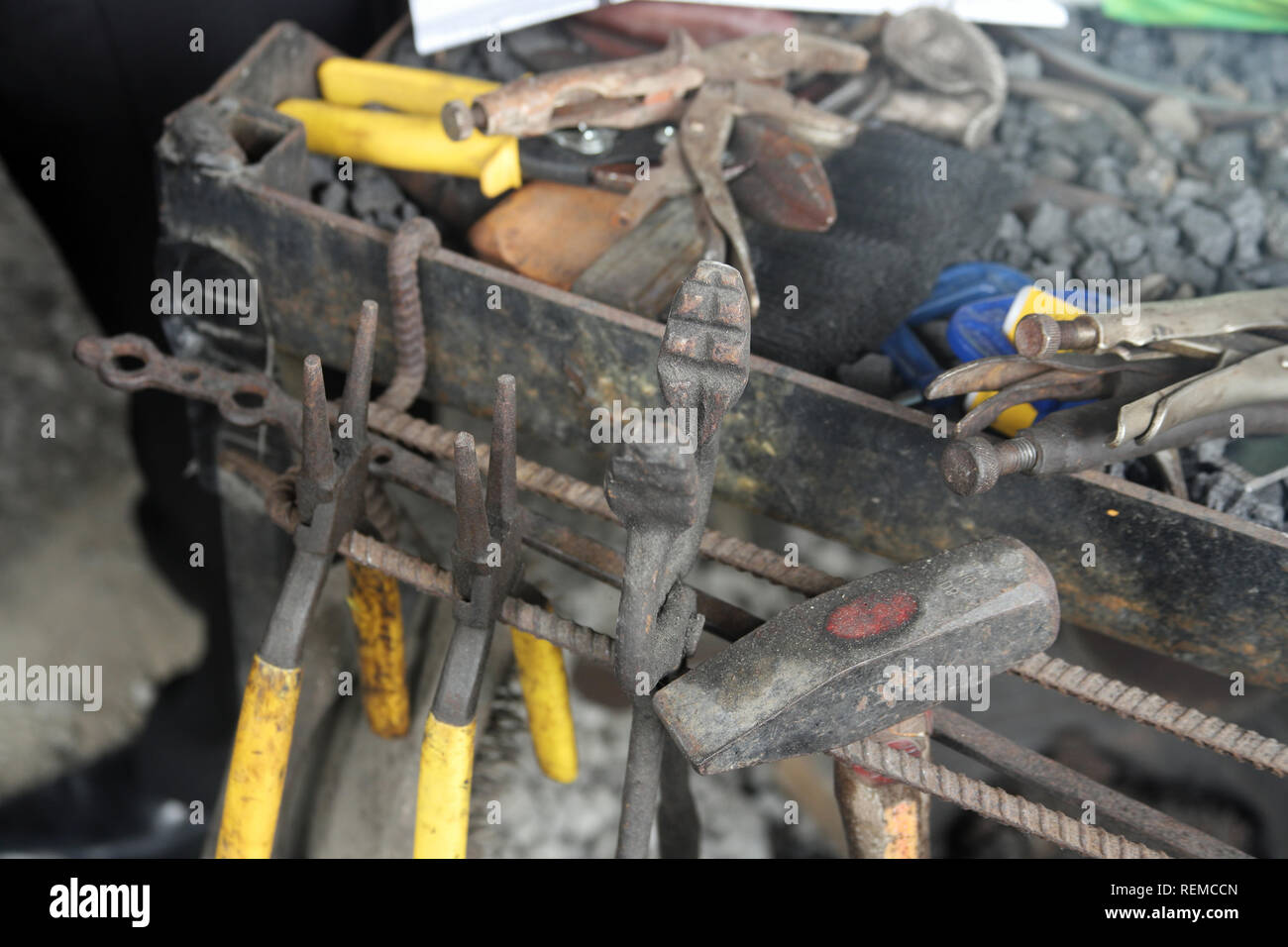 Blacksmith tools in workshop sitting next to forge Stock Photo - Alamy