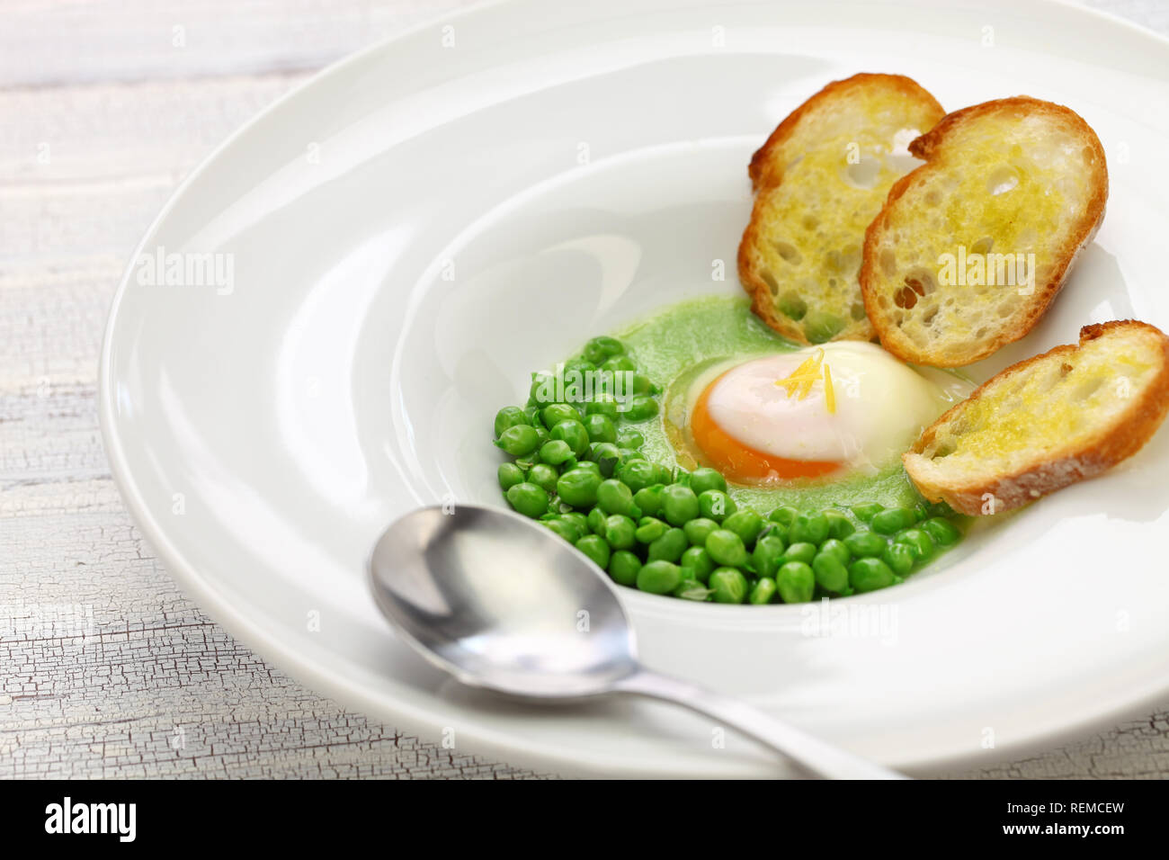 tear peas with poached egg, spanish basque cuisine Stock Photo - Alamy