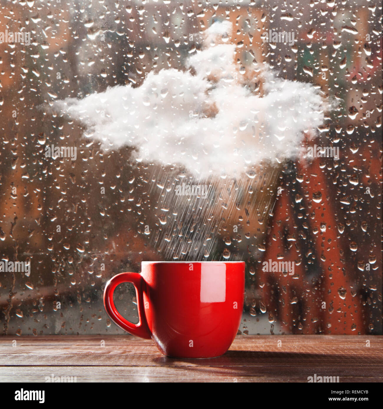 Small cloud raining into a cup Stock Photo - Alamy