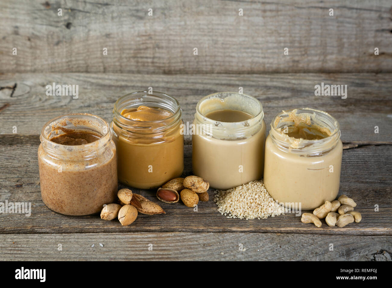 Selection of nut butters - peanut, cashew, almond and sesame seeds ...