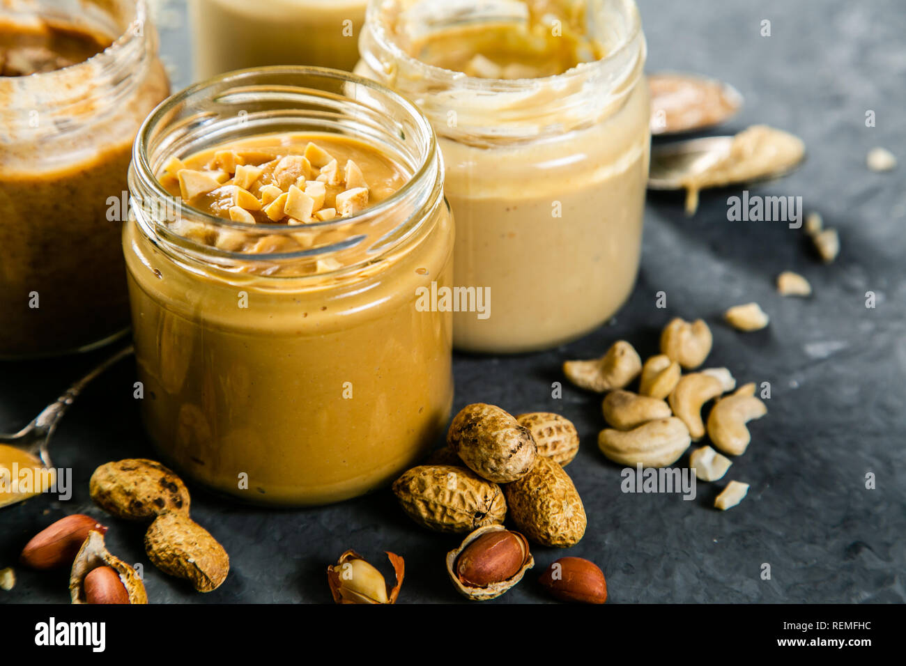 Selection of nut butters - peanut, cashew, almond and sesame seeds ...