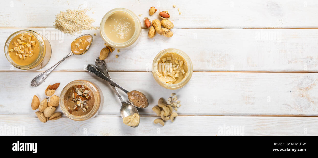 Selection of nut butters - peanut, cashew, almond and sesame seeds ...