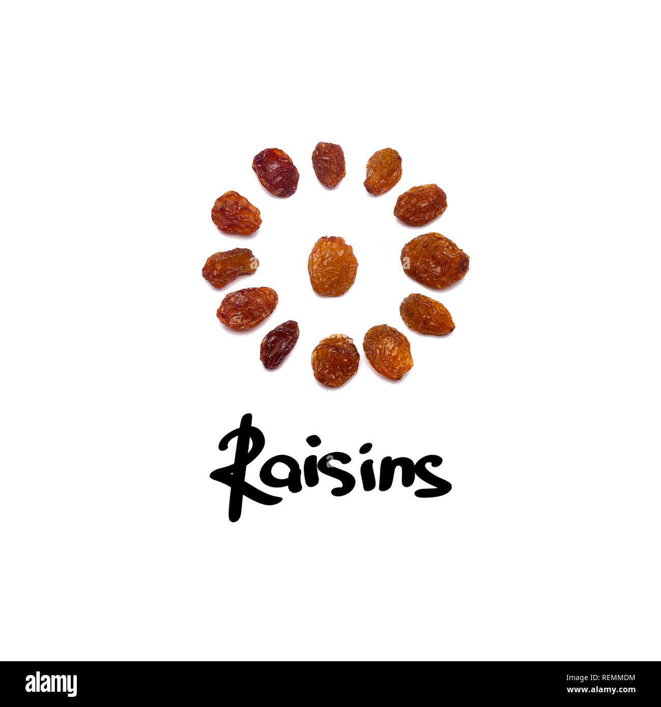 A collection of brown raisins lies in the shape of a circle or sun on ...