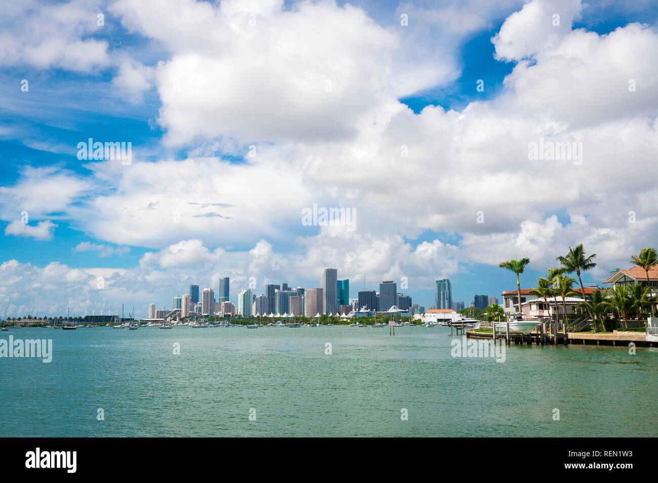 Bright tropical scenic view of the city skyline of Miami with ...
