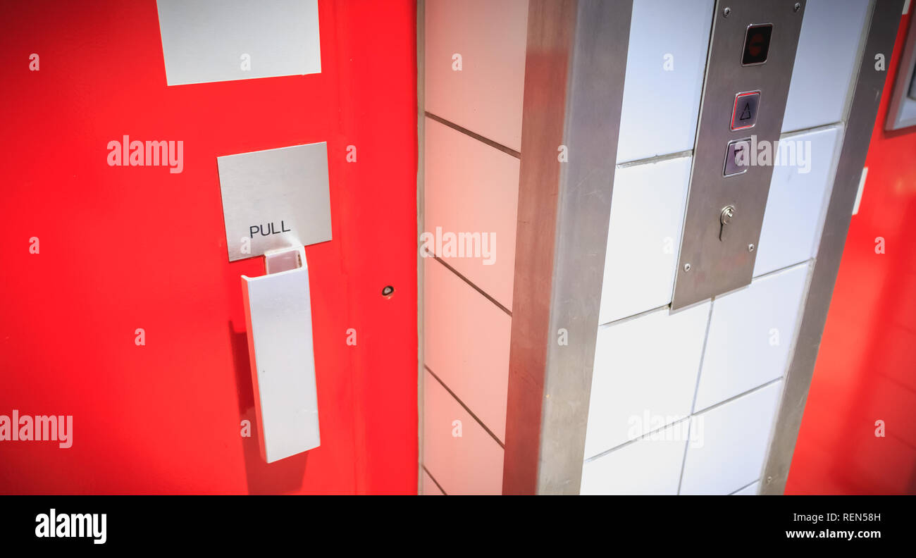 red metal elevator door where it is written pull Stock Photo - Alamy