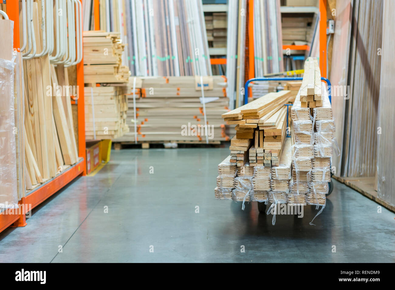 construction cart in the building store. Carts loaded with boards. shop ...