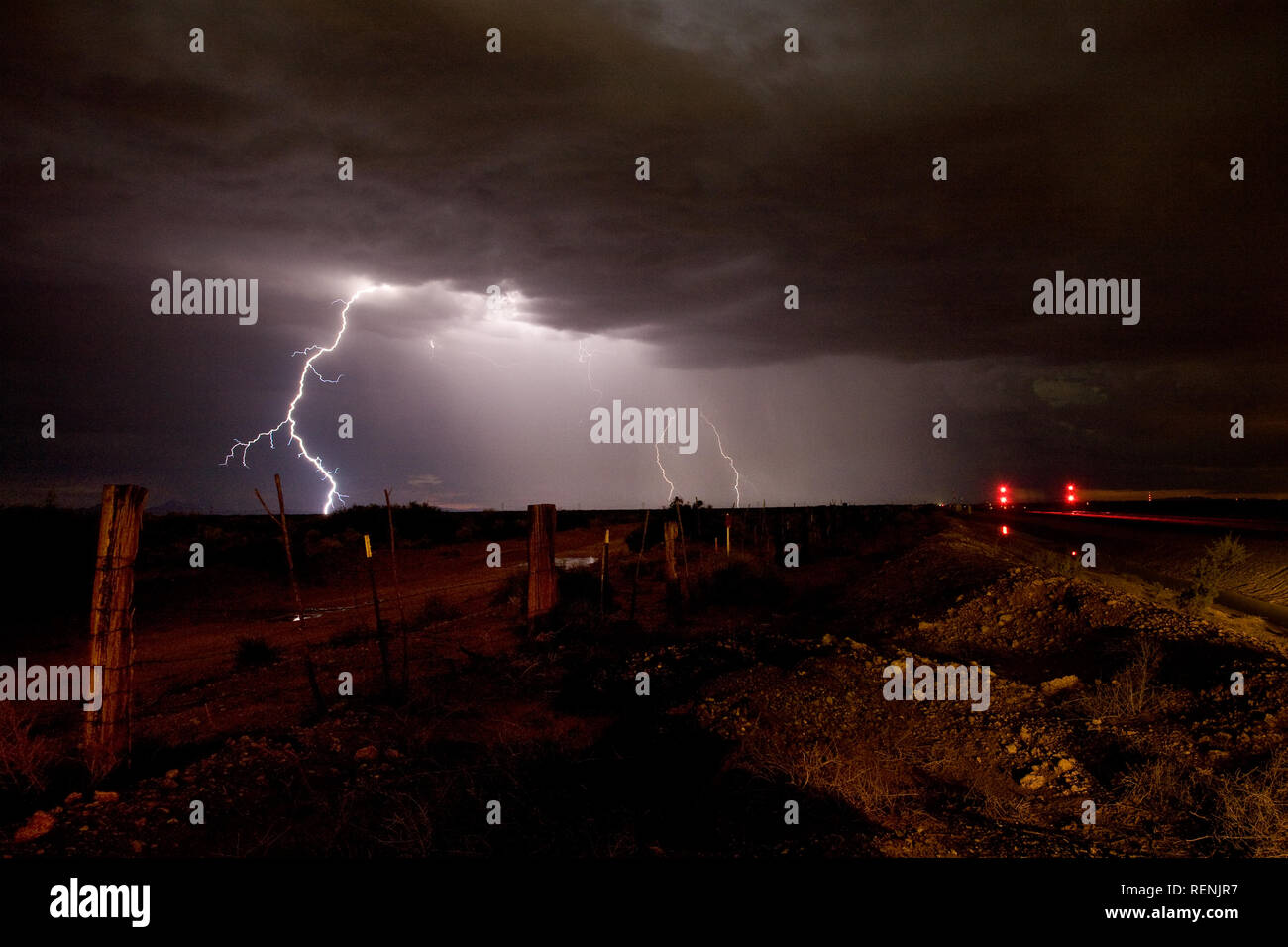 Monsoon Season Thunderstorm near Fence Line Stock Photo - Alamy