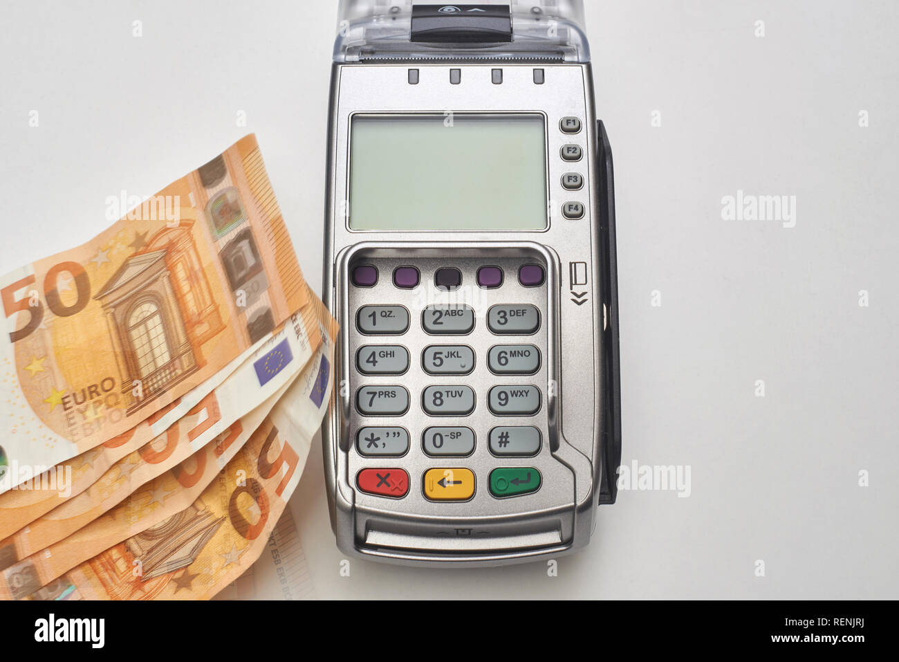 Credit card reader on money background Stock Photo - Alamy