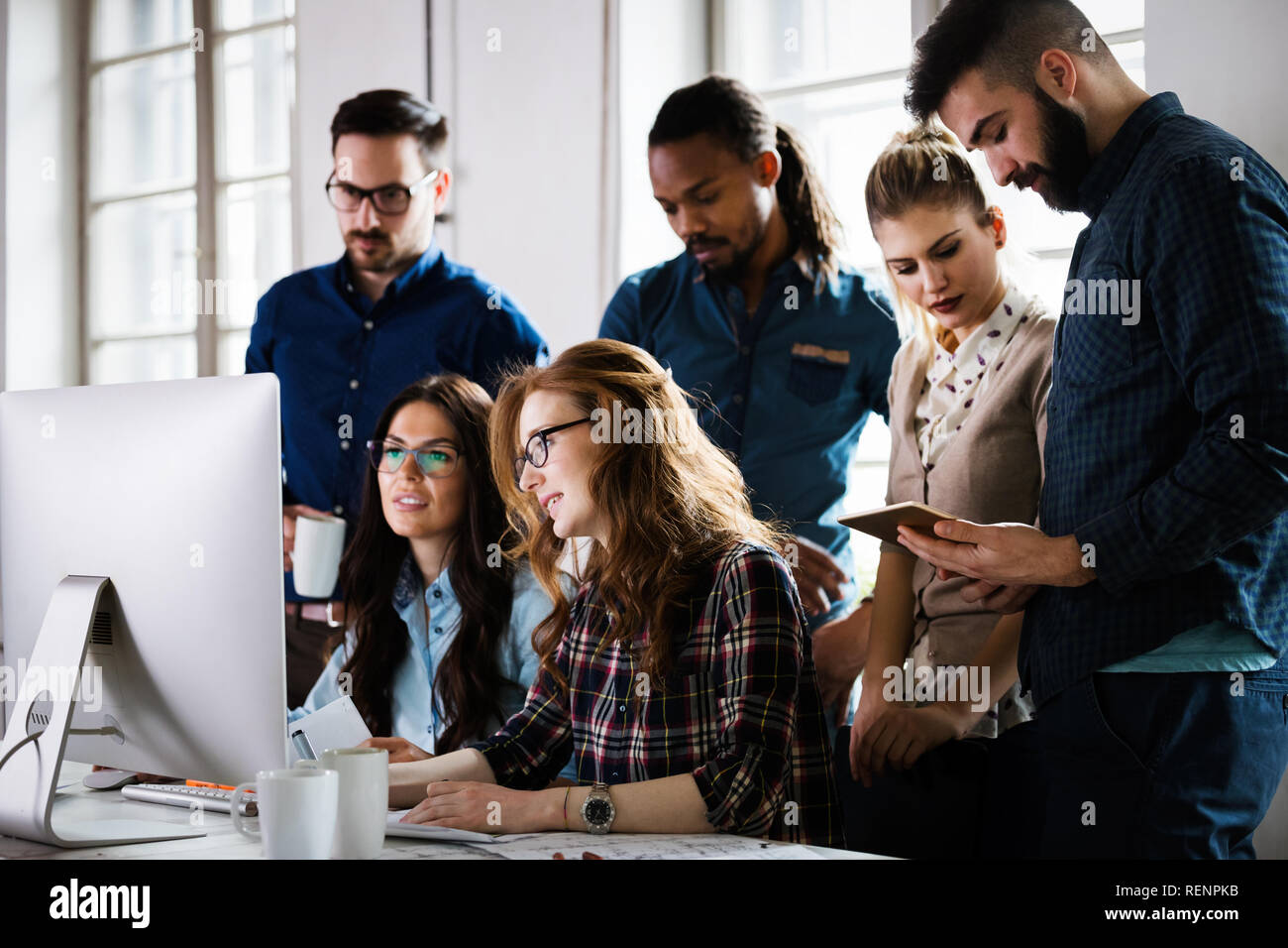 Young architects working on project in office Stock Photo - Alamy