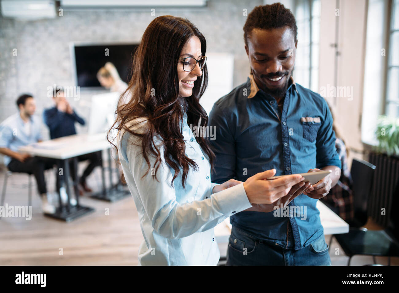 Portrait of architects having discussion in office Stock Photo - Alamy