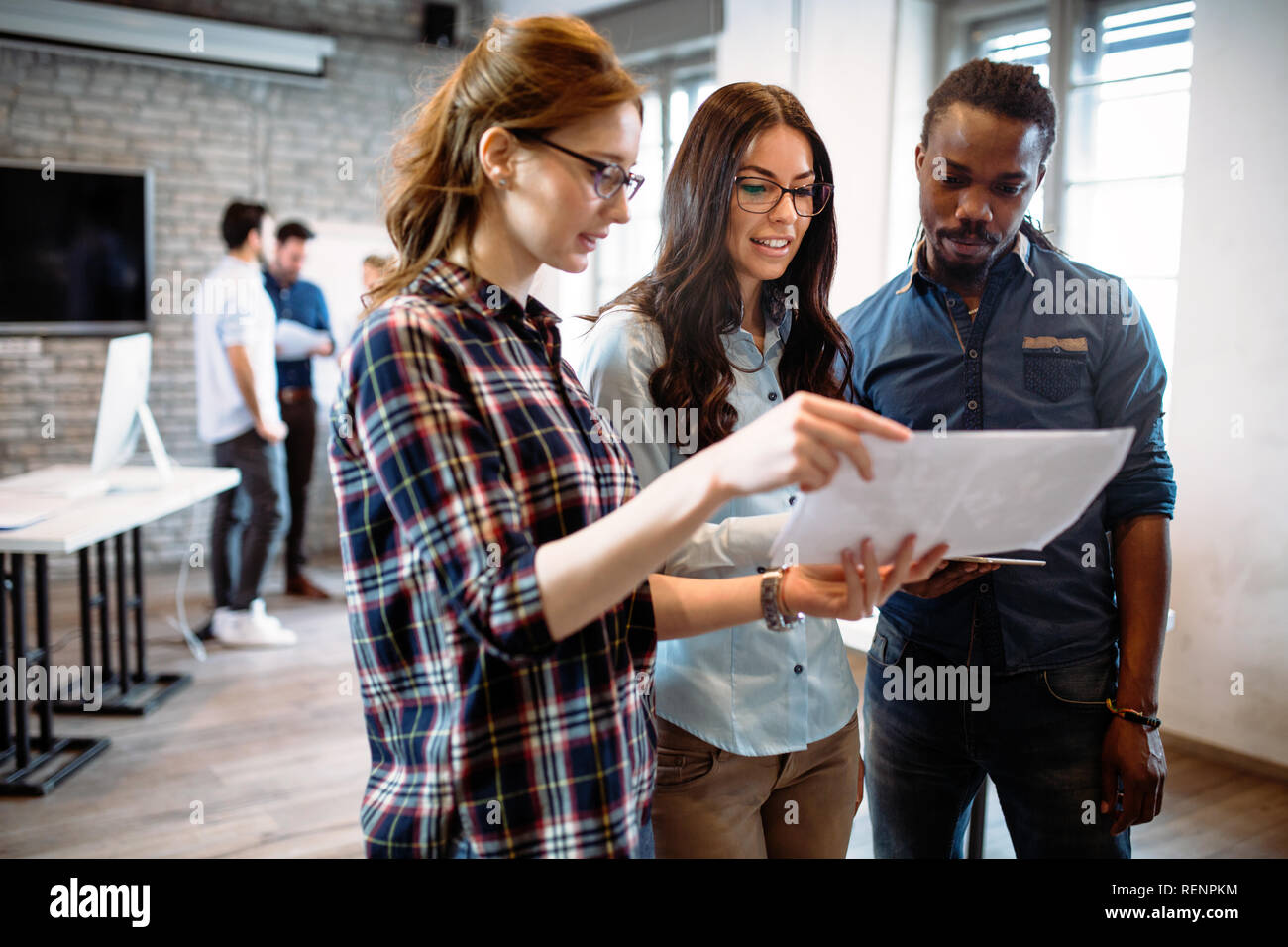 Portrait of architects having discussion in office Stock Photo - Alamy