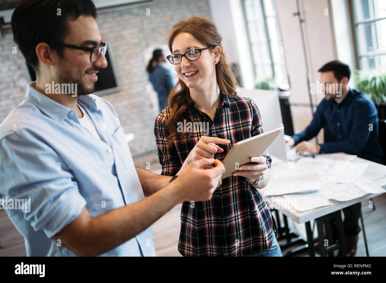 Portrait of architects having discussion in office Stock Photo - Alamy