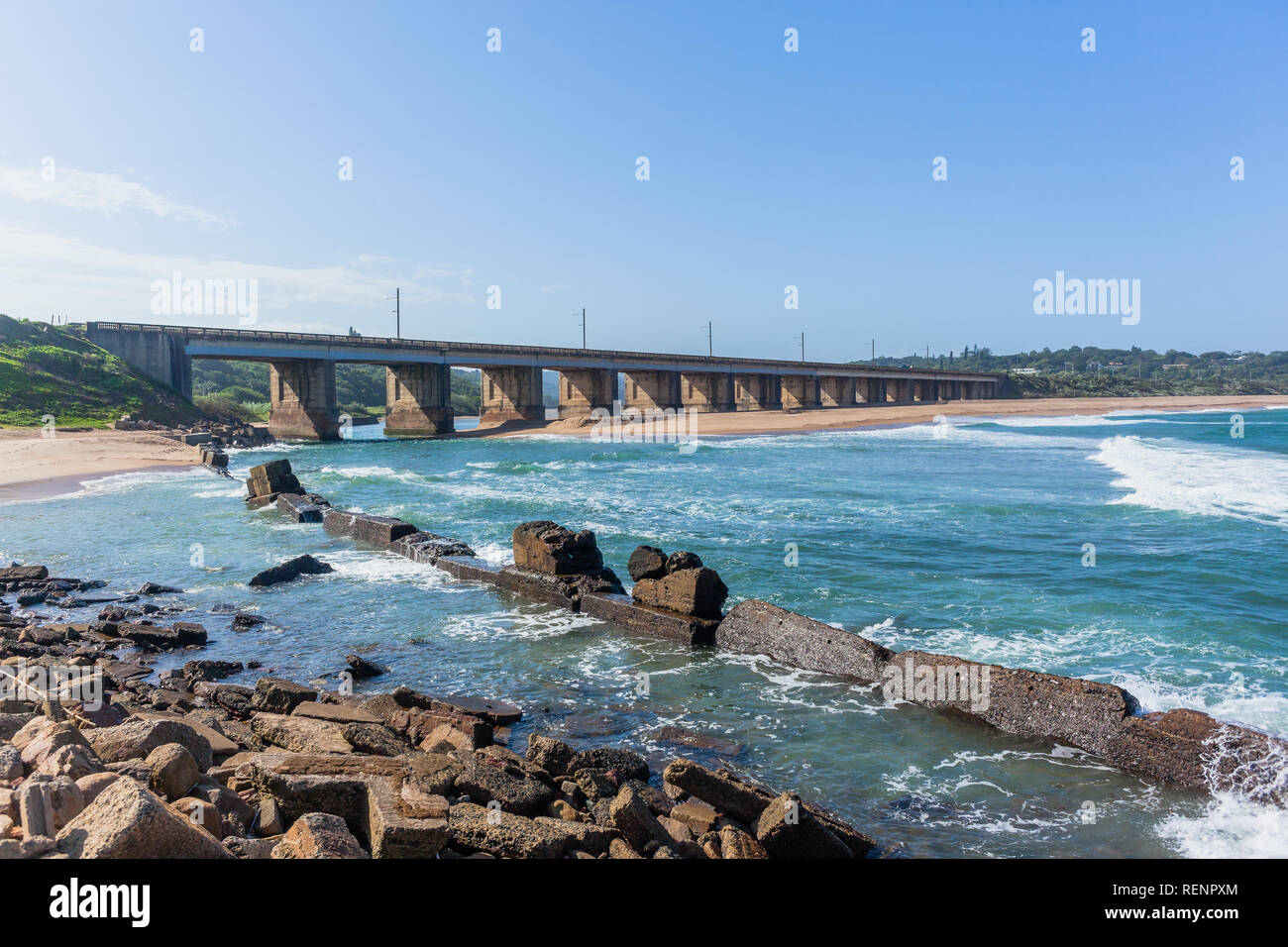 Long bridge structure crossing the wide river mouth estuary and beach ...