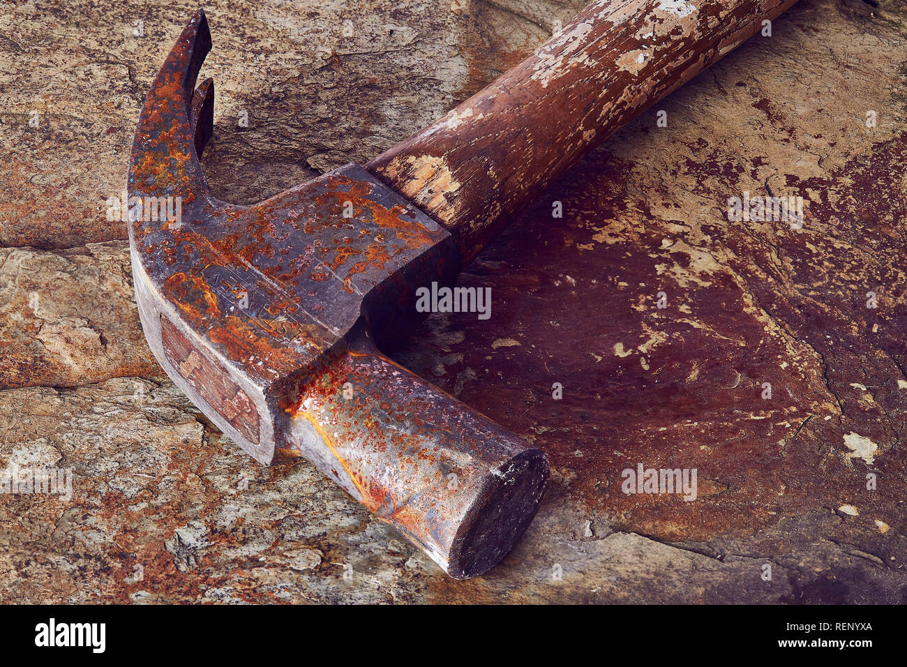 Old rusty hammer and stone texture Stock Photo - Alamy