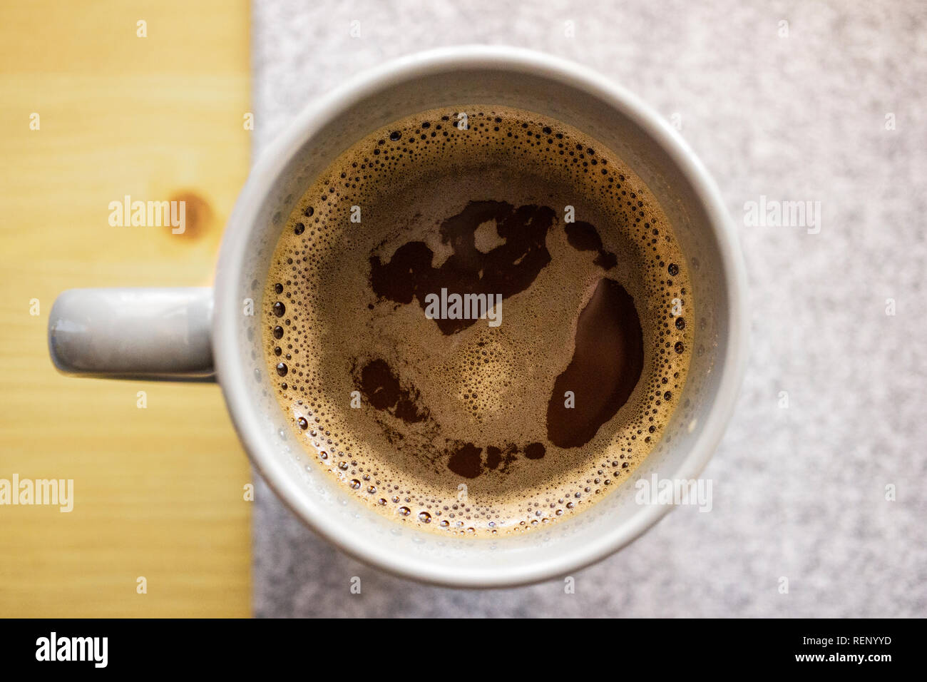 Mug of coffee on minimalist background from directly above Stock Photo ...