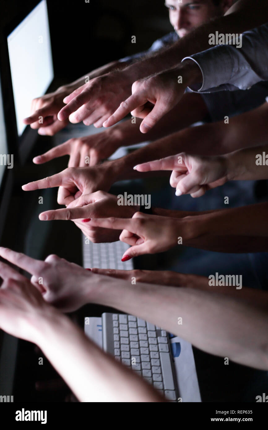 business team pointing their fingers at the blank computer screen Stock ...
