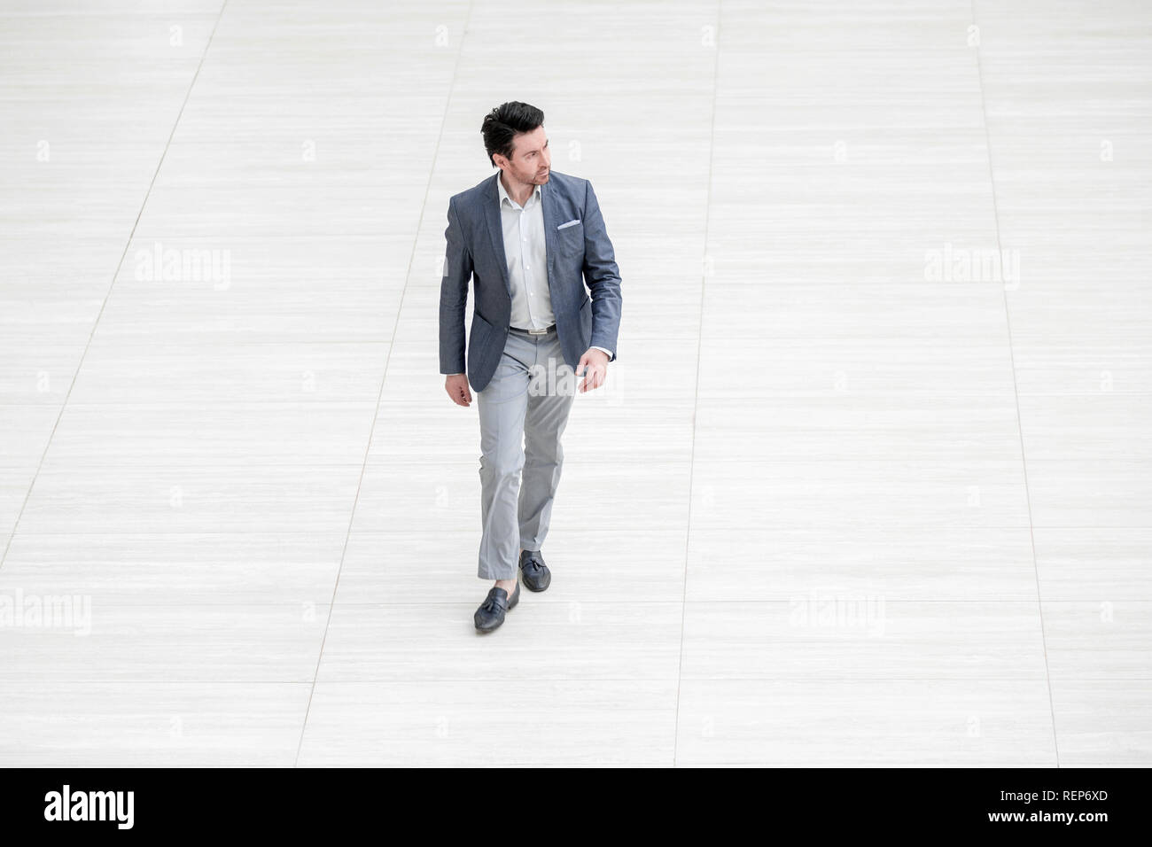 Young white male walking confidently hi-res stock photography and ...