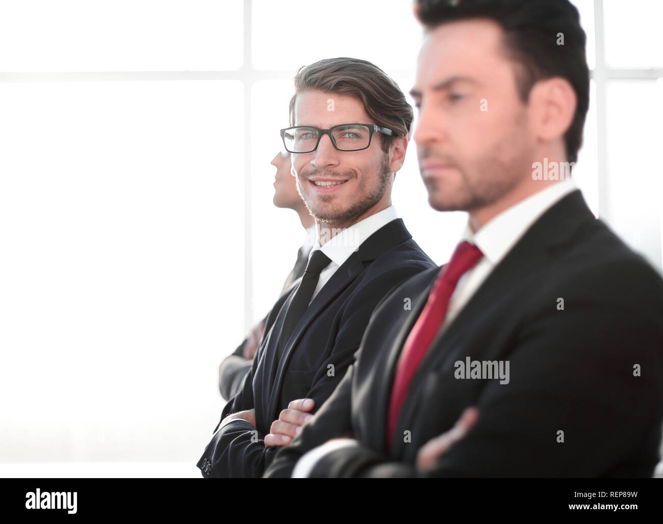side view. a group of thoughtful businessmen standing near an office ...