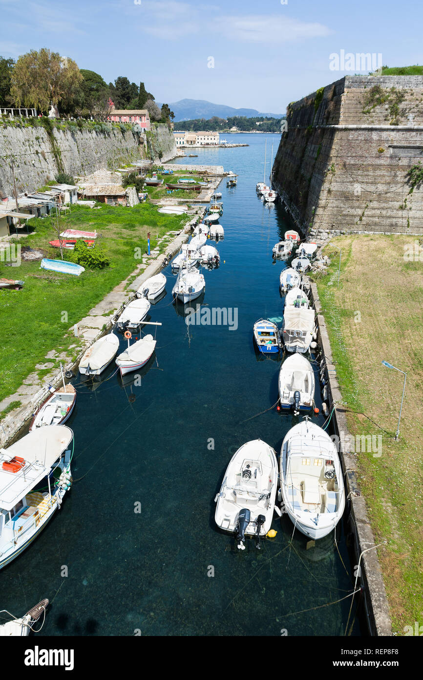 The old Fortress, Corfu town, Greece. The Contrafossa canal that ...