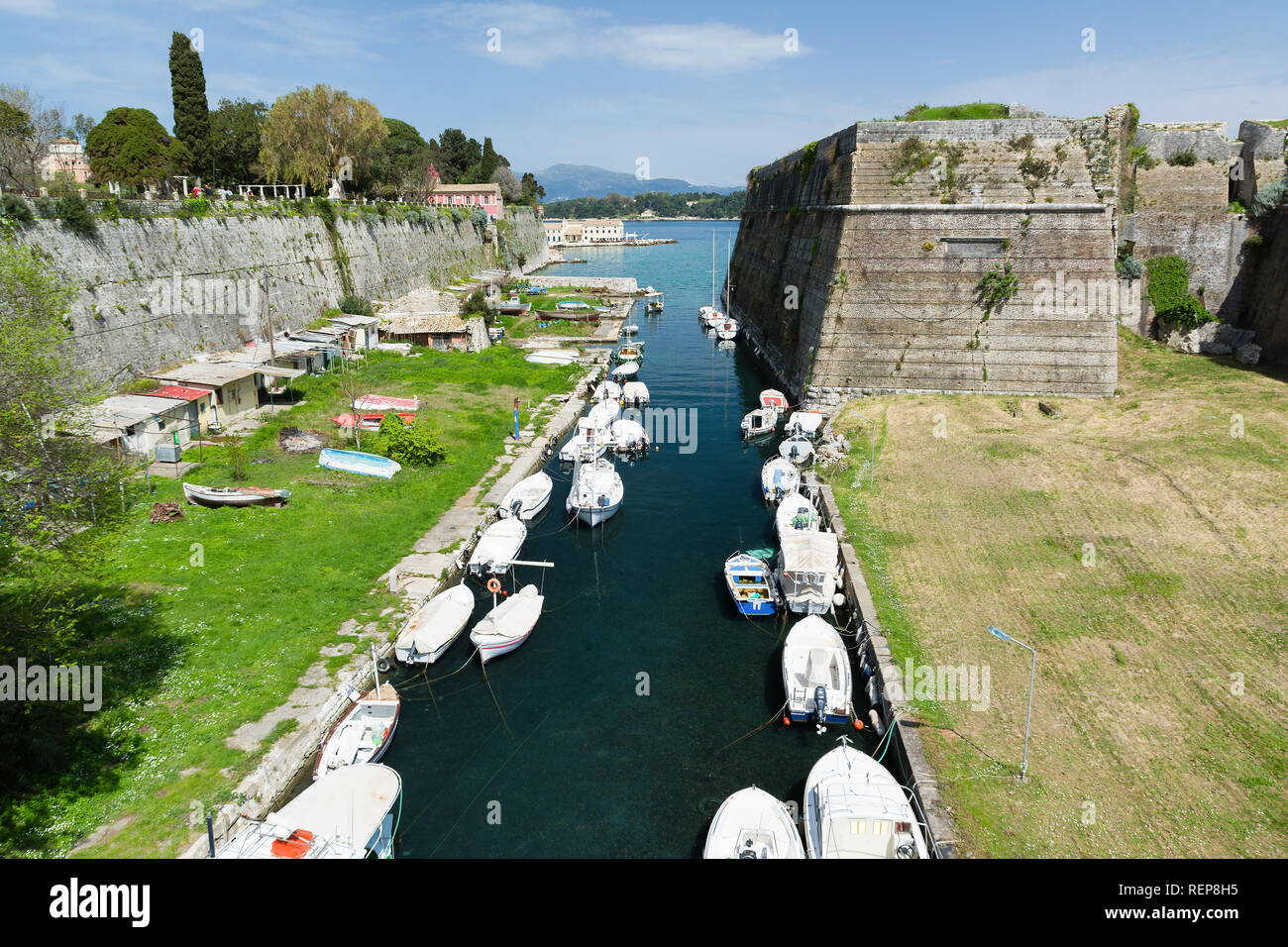 The old Fortress, Corfu town, Greece. The Contrafossa canal that ...