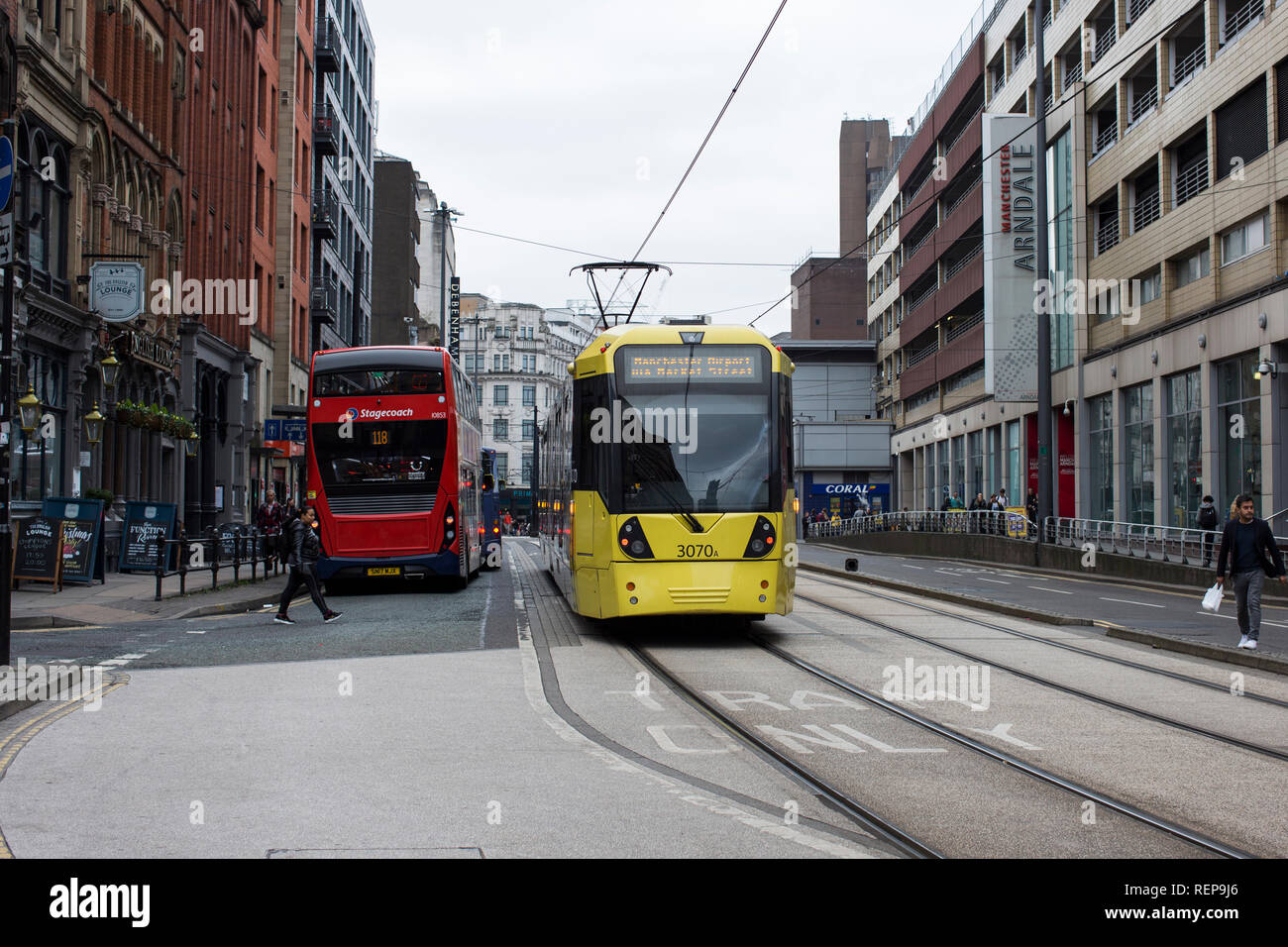 Yellow Metrolink tram in Manchester City Centre Stock Photo - Alamy