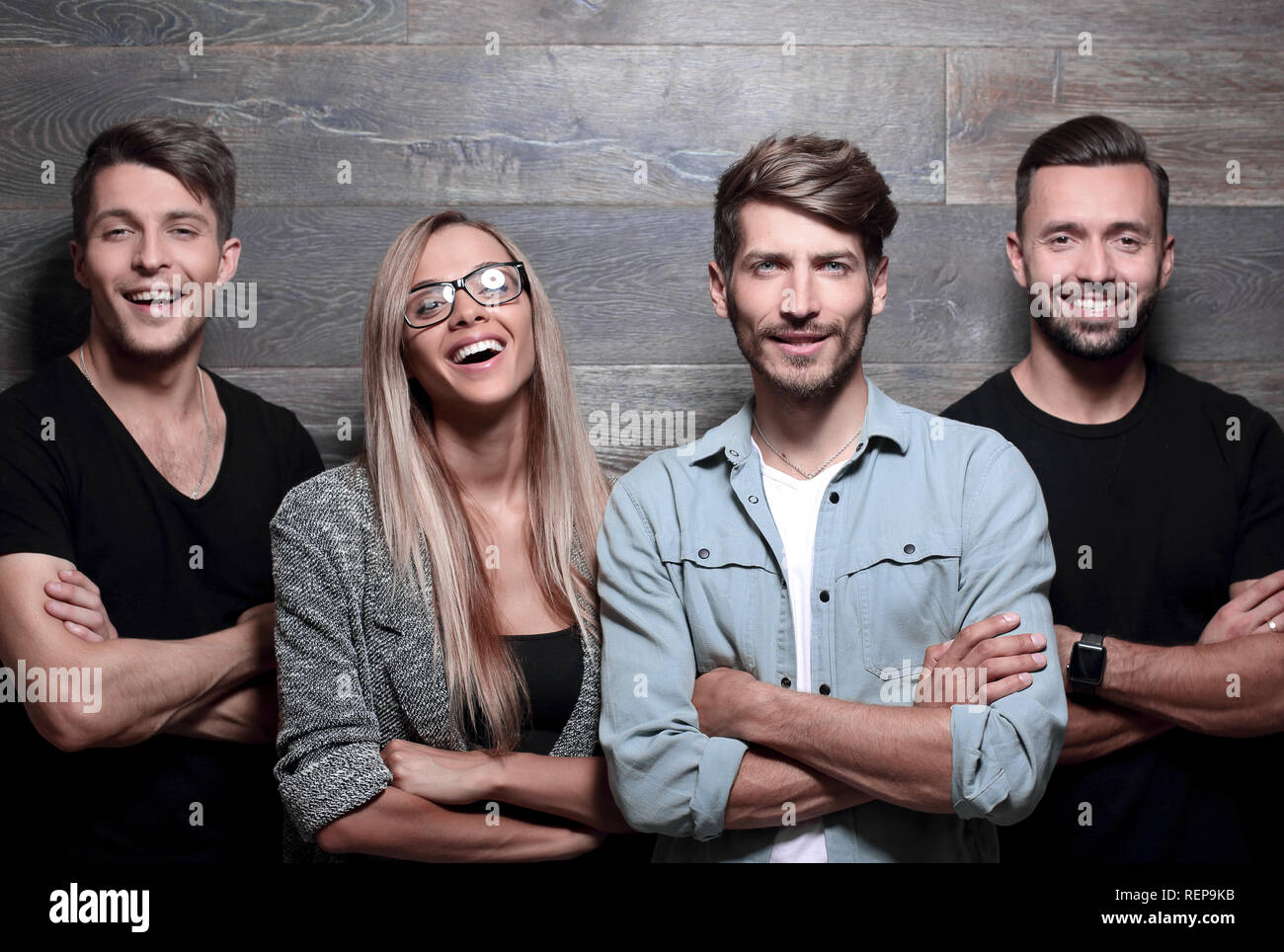 a group of young people stand and smile Stock Photo - Alamy