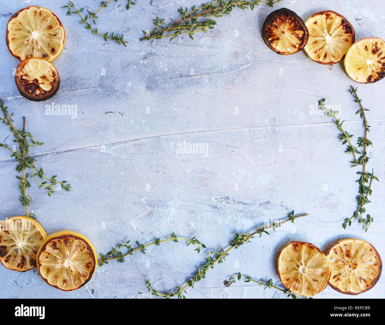 Roasted lemon and thyme food photo frame Stock Photo - Alamy
