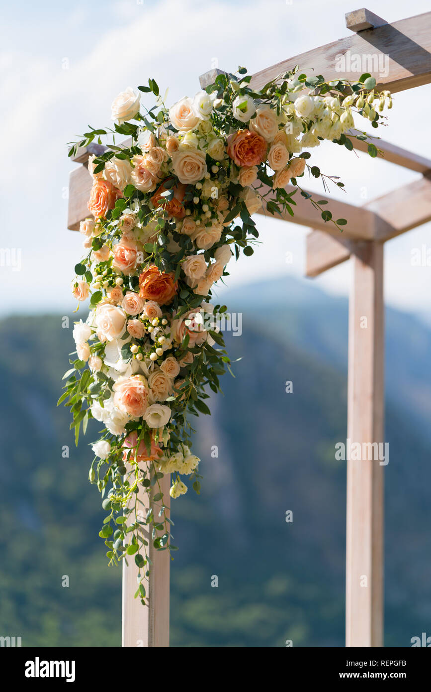 Beautiful wooden wedding arch decorated with flowers Stock Photo - Alamy