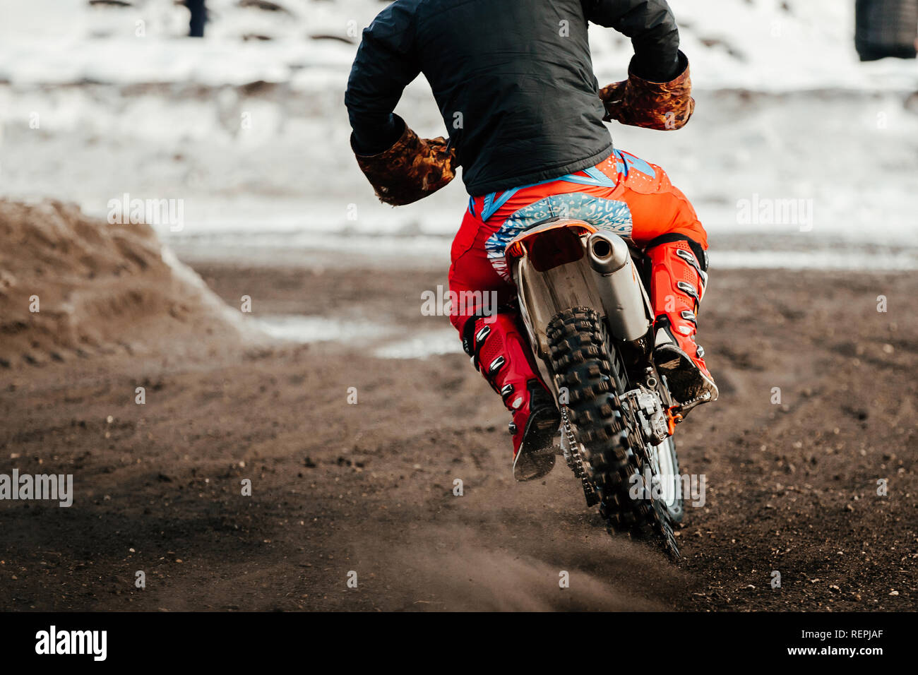 racer enduro motorcycle riding on winter track Stock Photo - Alamy