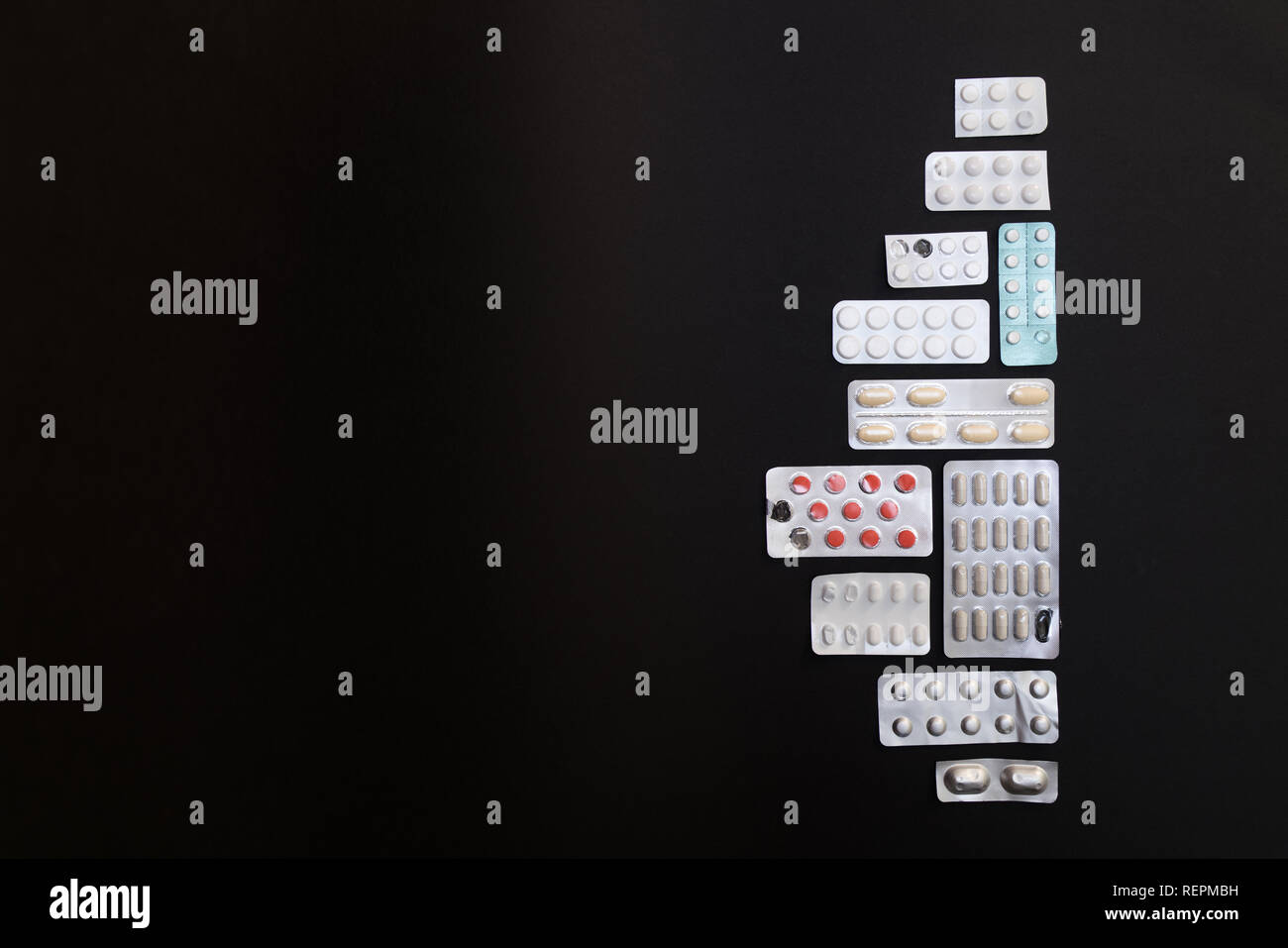 Packaging of tablets and pills on black background. Drug prescription ...