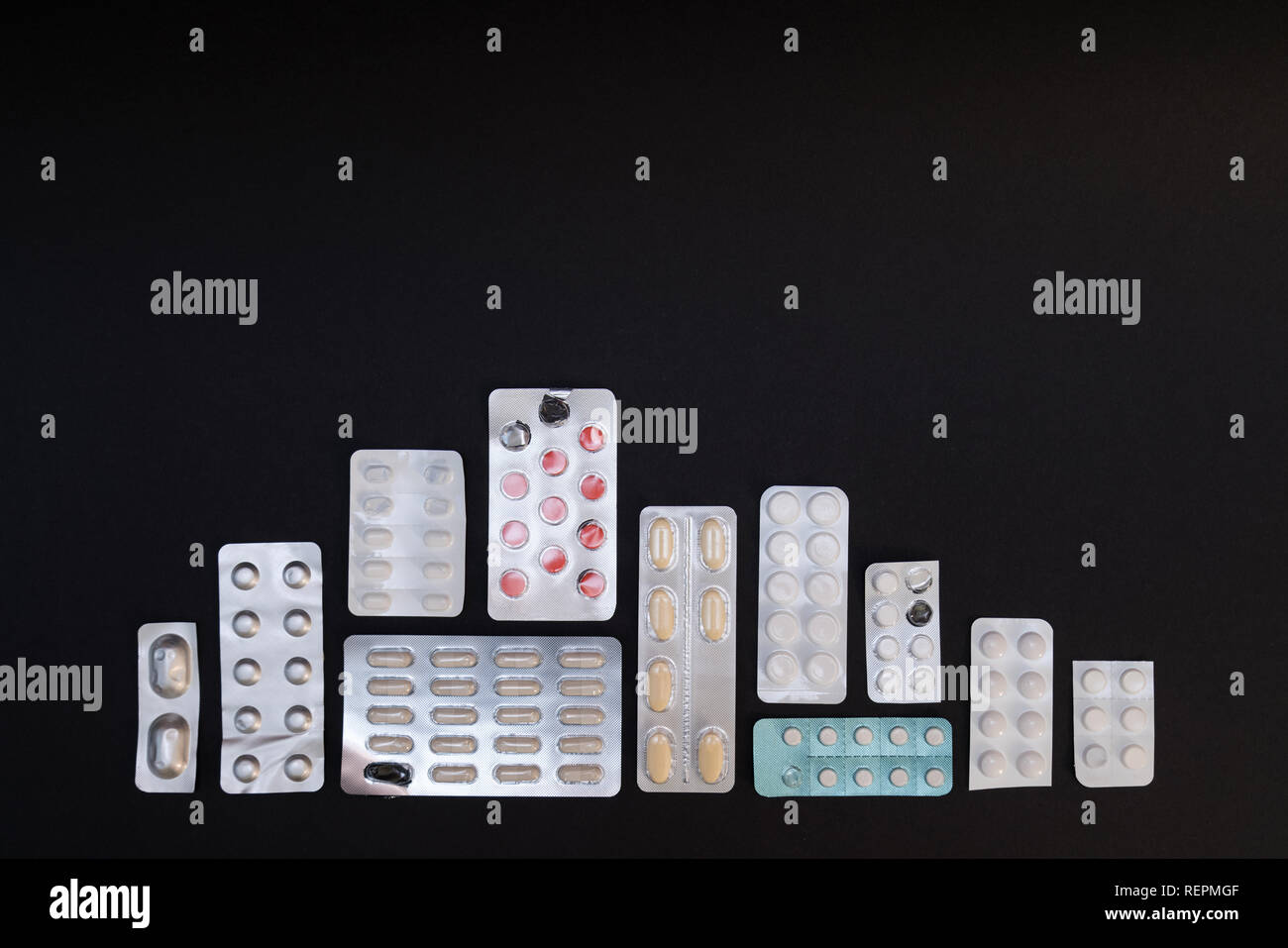 Packaging of tablets and pills on black background. Drug prescription ...