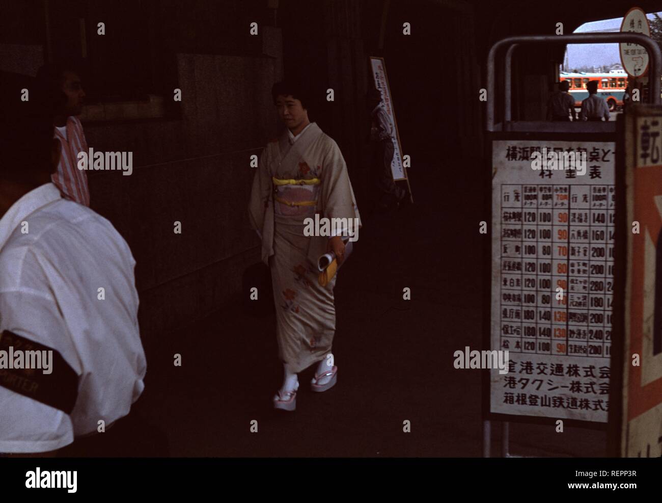 Color photograph of a Japanese woman, in full-length, three quarter ...