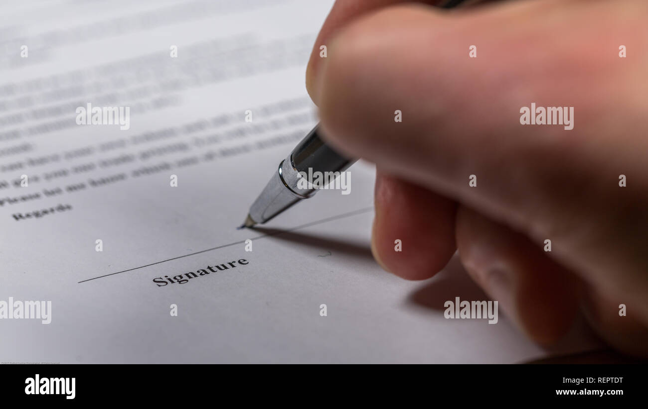 Man Hand Signing a Contract Document Stock Photo - Alamy