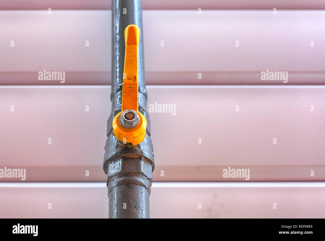 Metal pipe with open switch. Close-up Stock Photo - Alamy