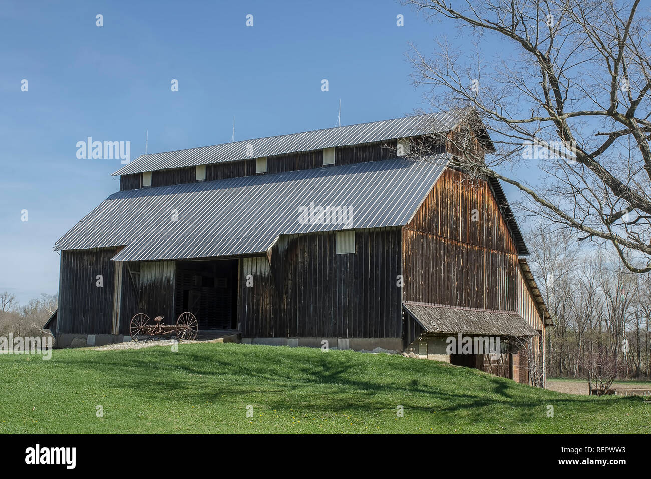 A beautiful wooden barn at the beginning of spring Stock Photo - Alamy