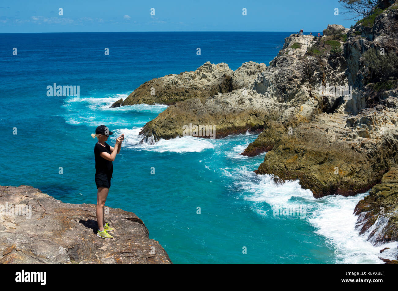 A young woman taking a photograph with a phone at North Gorge Walk ...