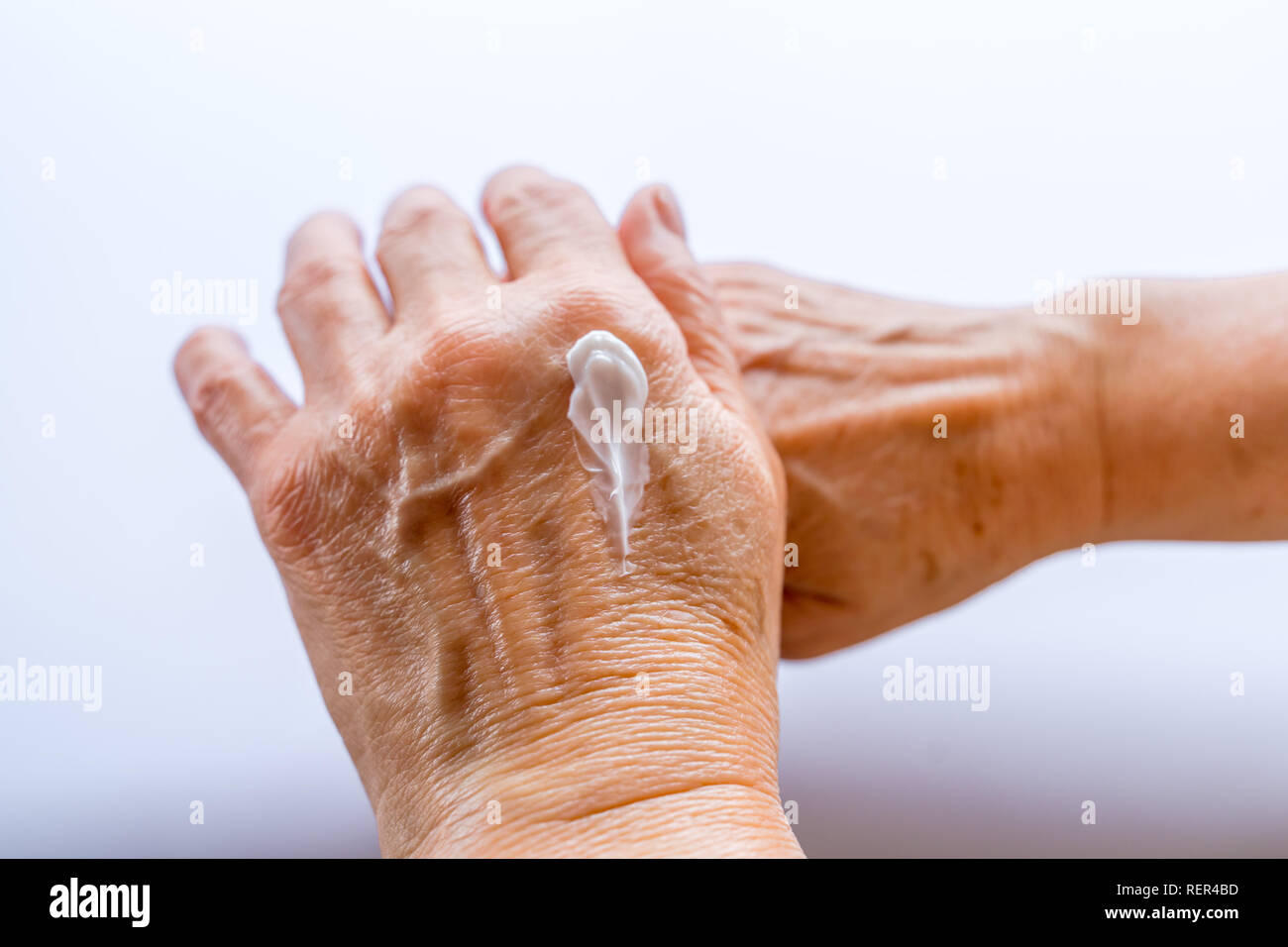 Skin Care Elderly Woman Applies Cream On Her Hands Beauty Product