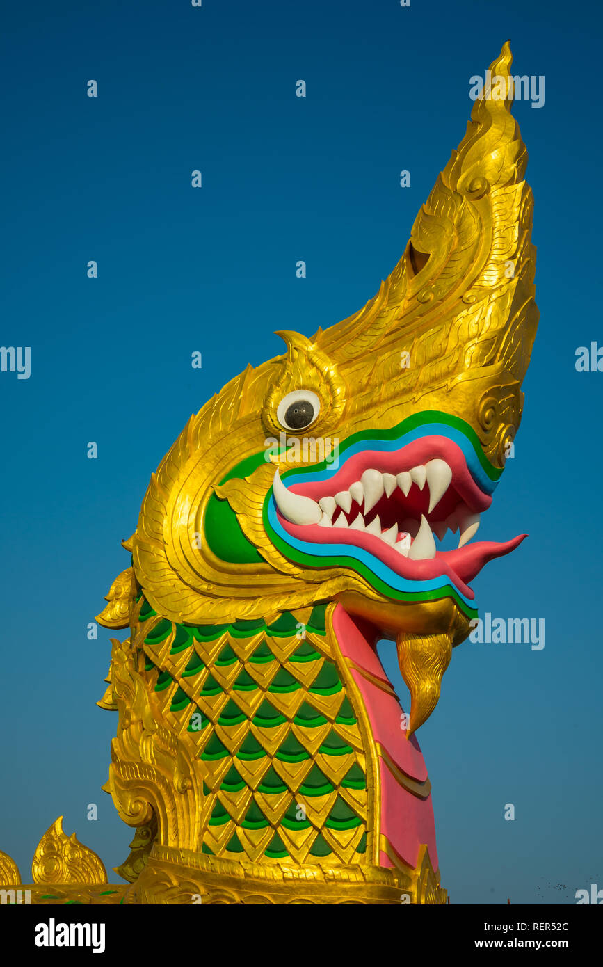 Large golden naga on the blue sky background Stock Photo - Alamy