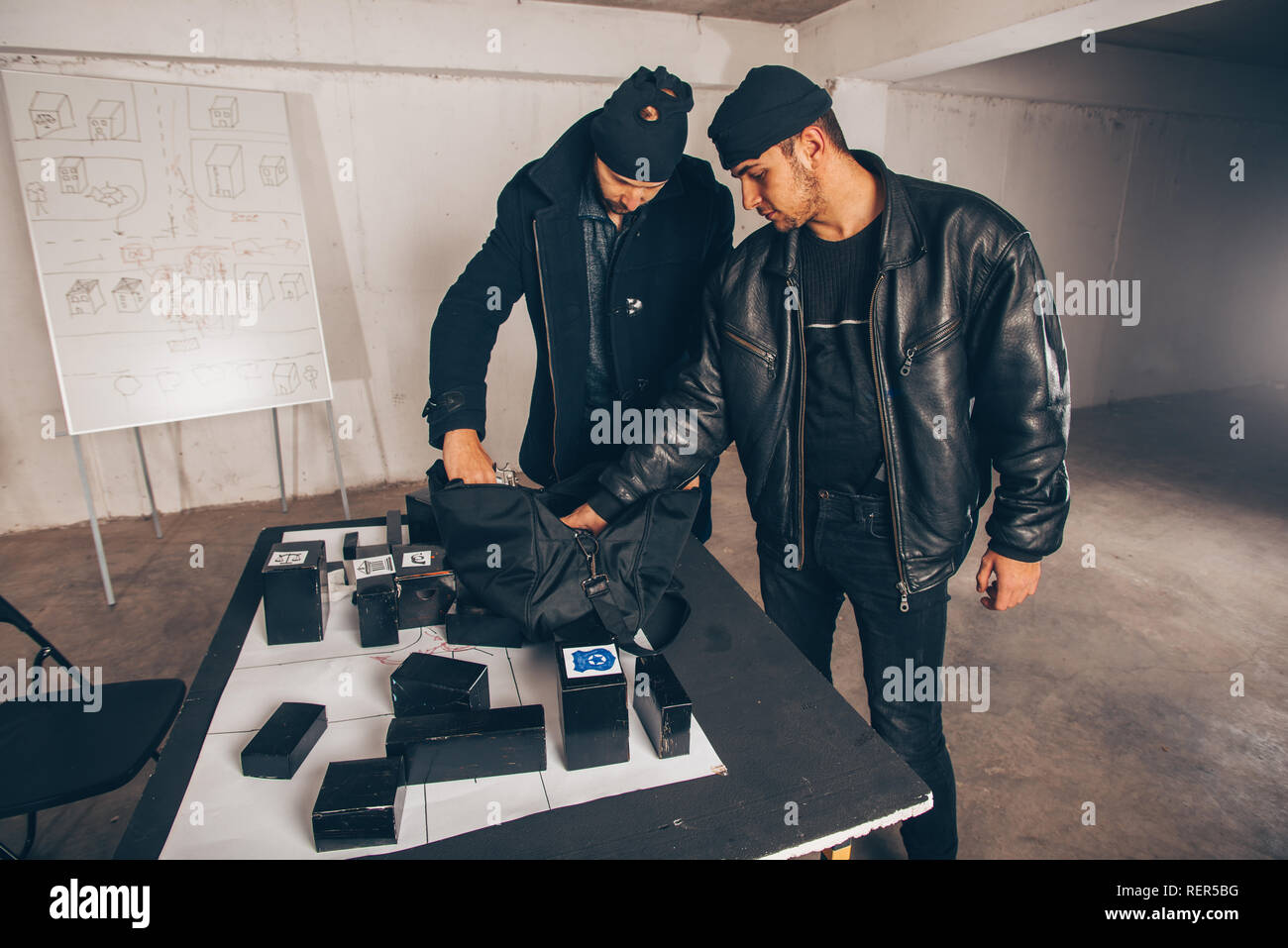 Violent robbers talking and counting stolen money Stock Photo - Alamy