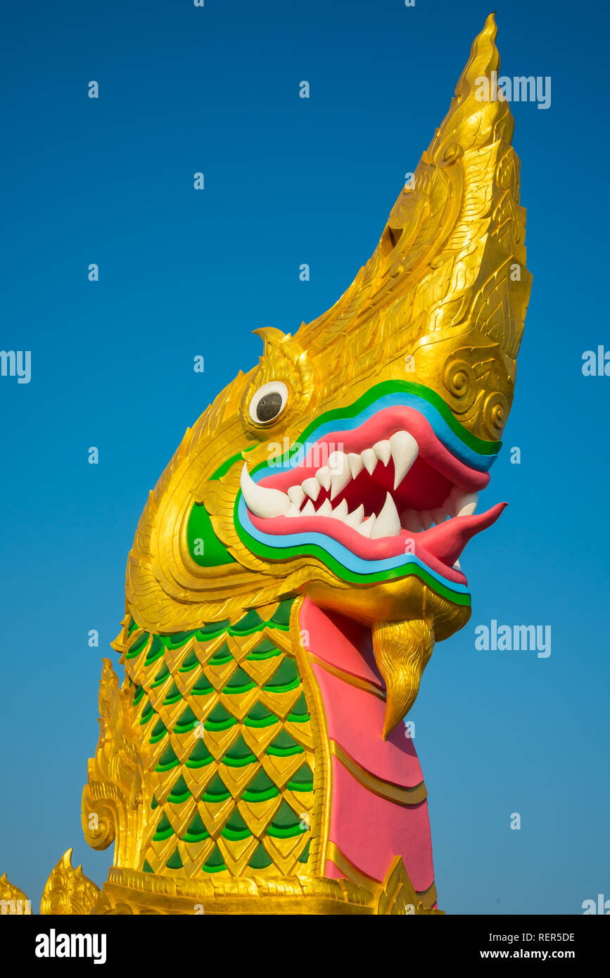 Large golden naga on the blue sky background Stock Photo - Alamy