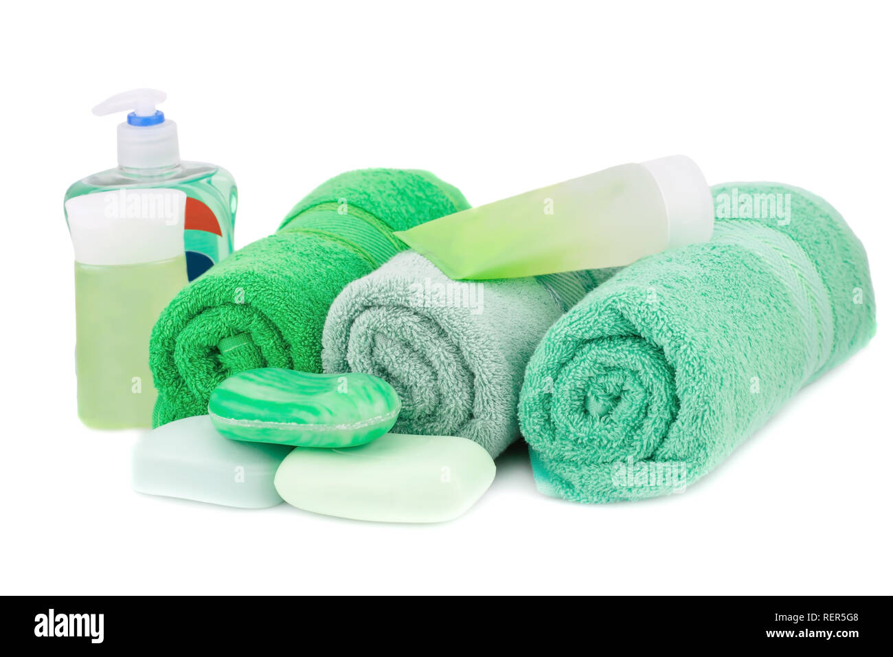 Spa set with towels, cream, lotion and soaps isolated on white ...