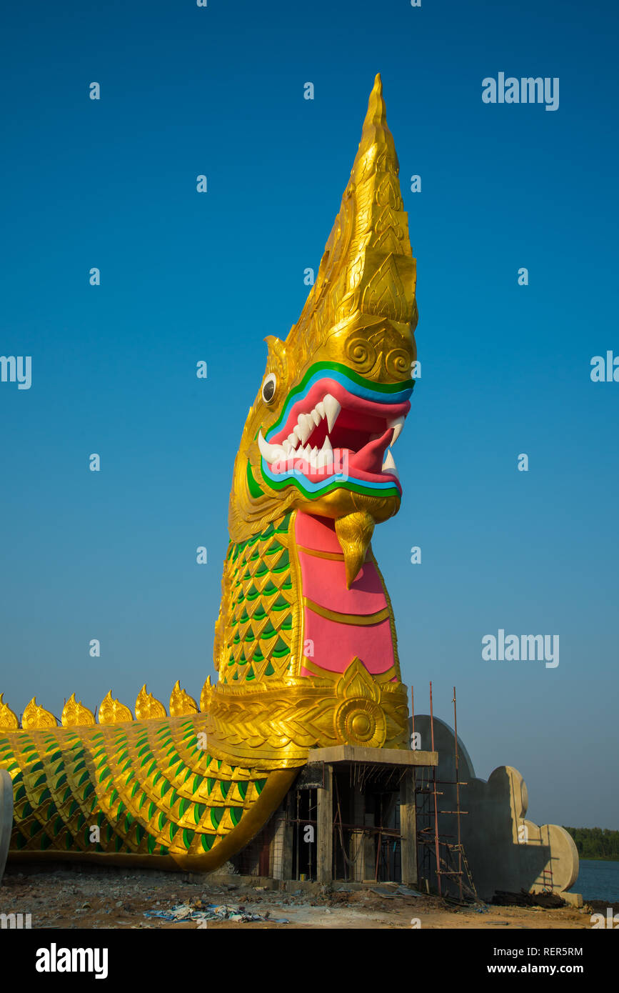 Large golden naga on the blue sky background Stock Photo - Alamy