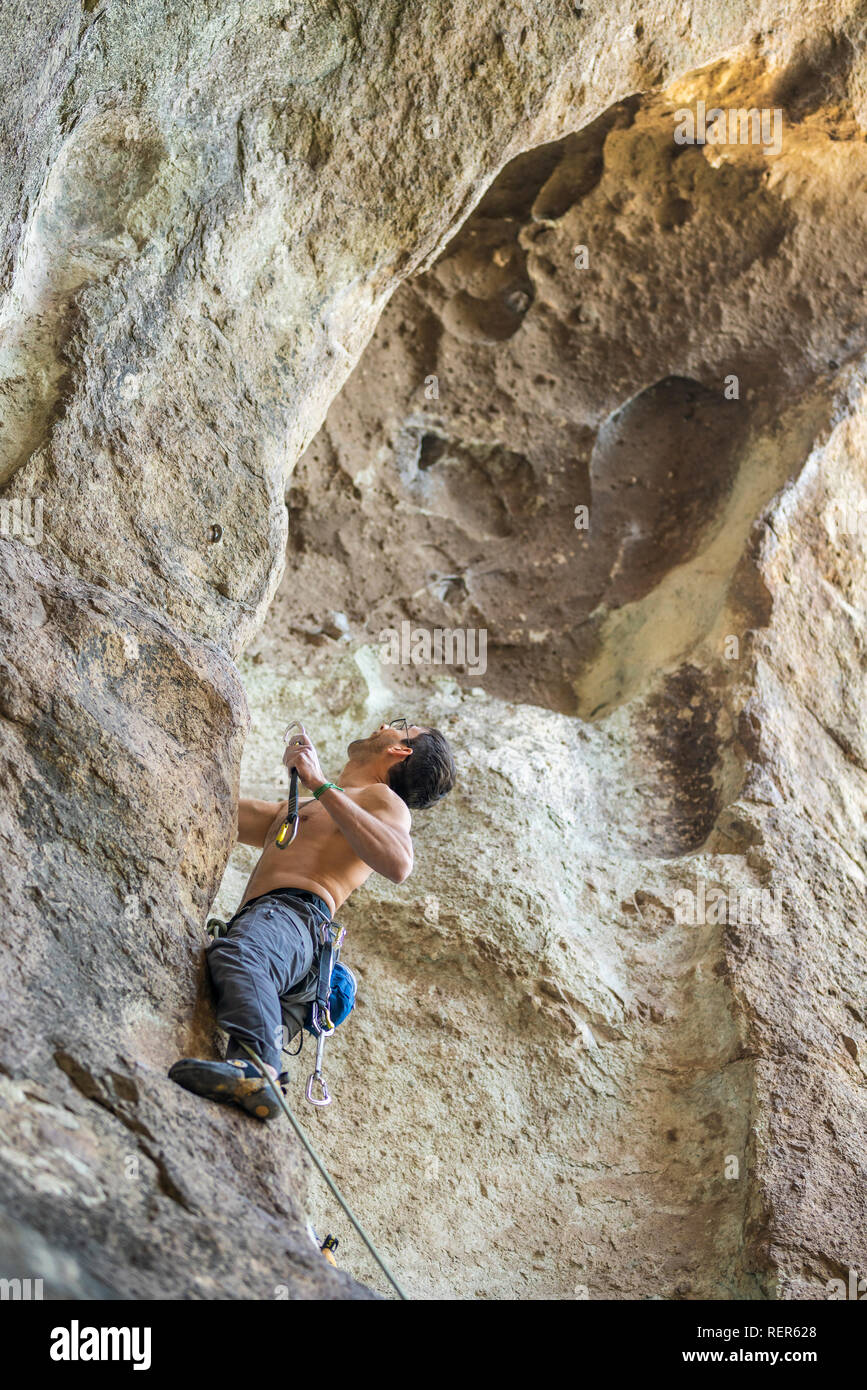 Practicing rock climbing extreme sport inside Andes mountains at a rock ...