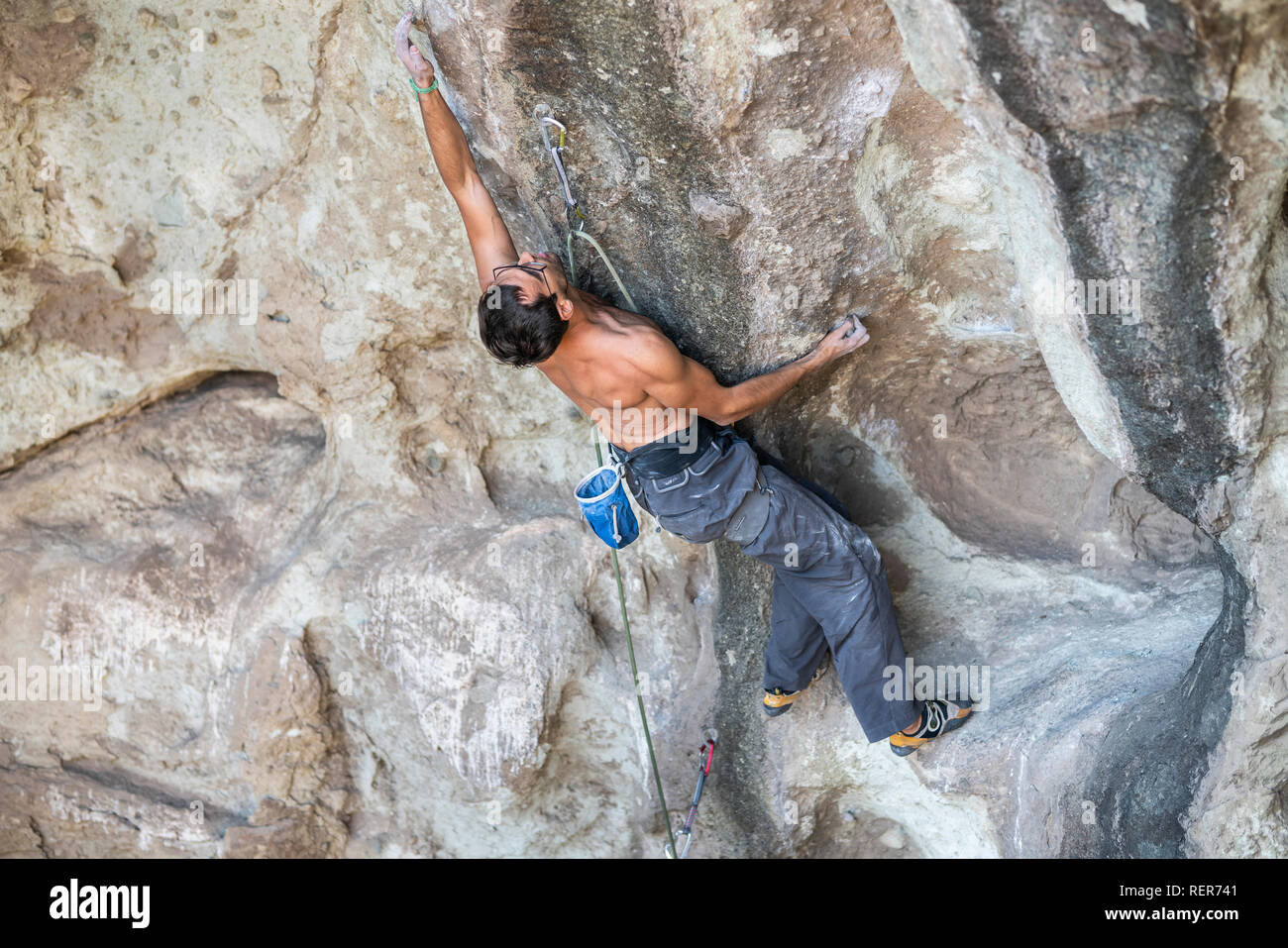 Practicing rock climbing extreme sport inside Andes mountains at a rock ...