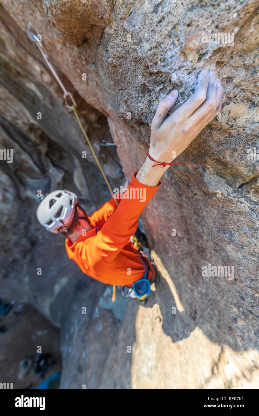 Practicing rock climbing extreme sport inside Andes mountains at a rock ...
