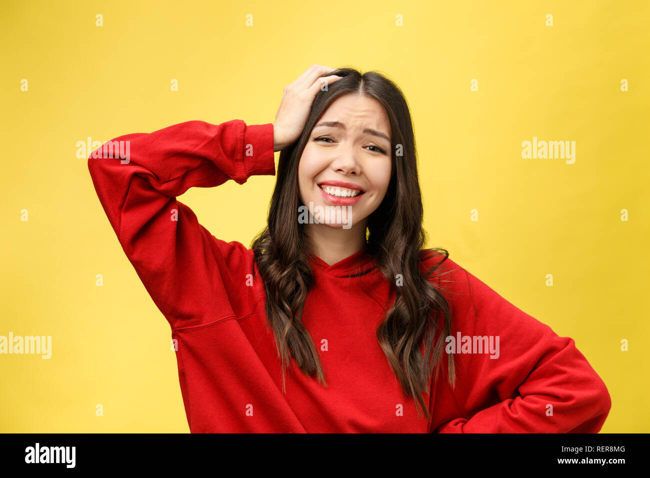 Portrait Happy Asian girl is surprised she is excited.Yellow background ...
