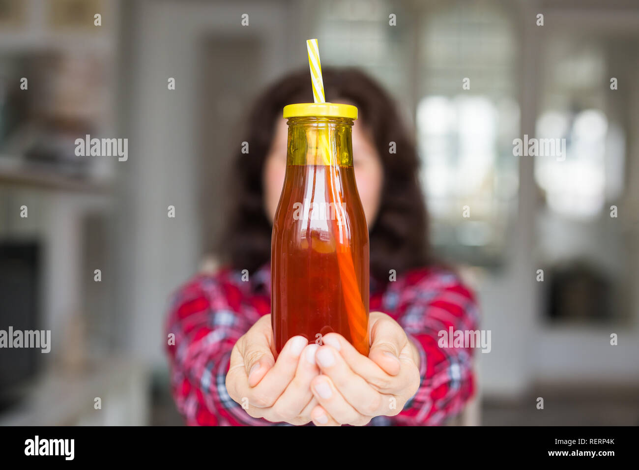 Drinks, diet and healthy lifestyle concept - woman giving you a bottle ...